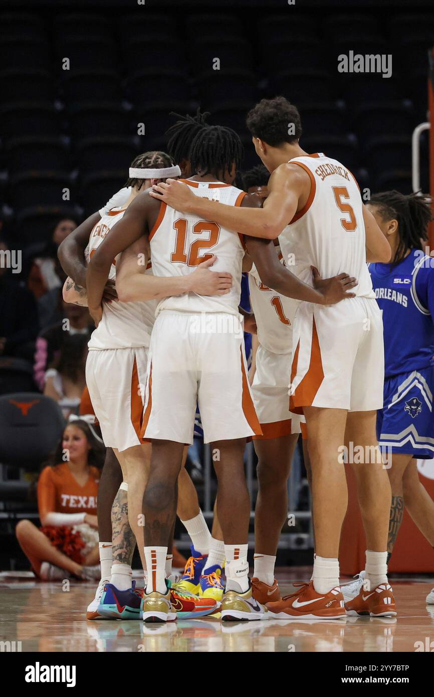 AUSTIN, TX - DECEMBER 19: Texas players huddle up during the college ...