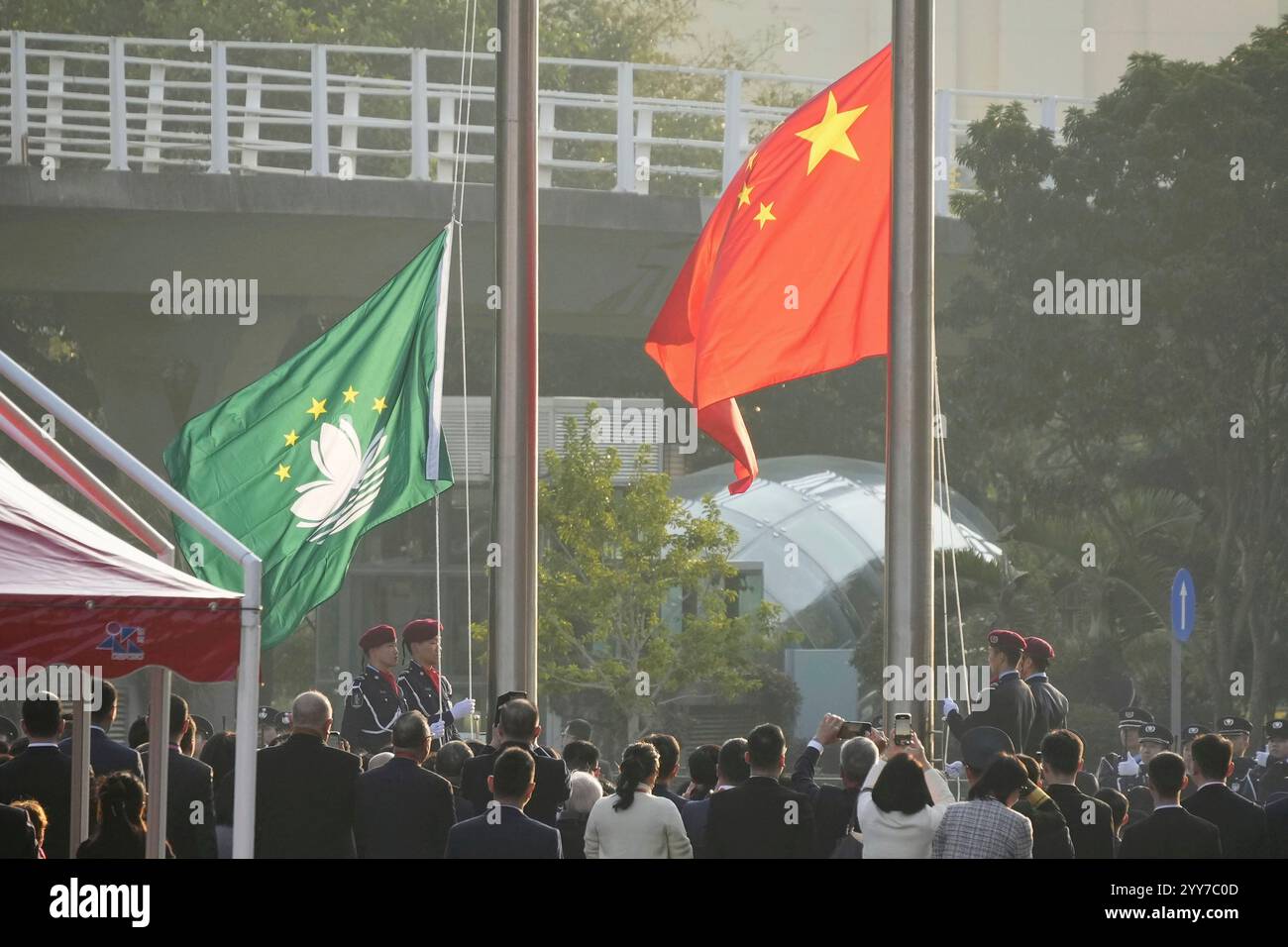 Chinese and Macau flags are seen during a flag-raising ceremony marking ...