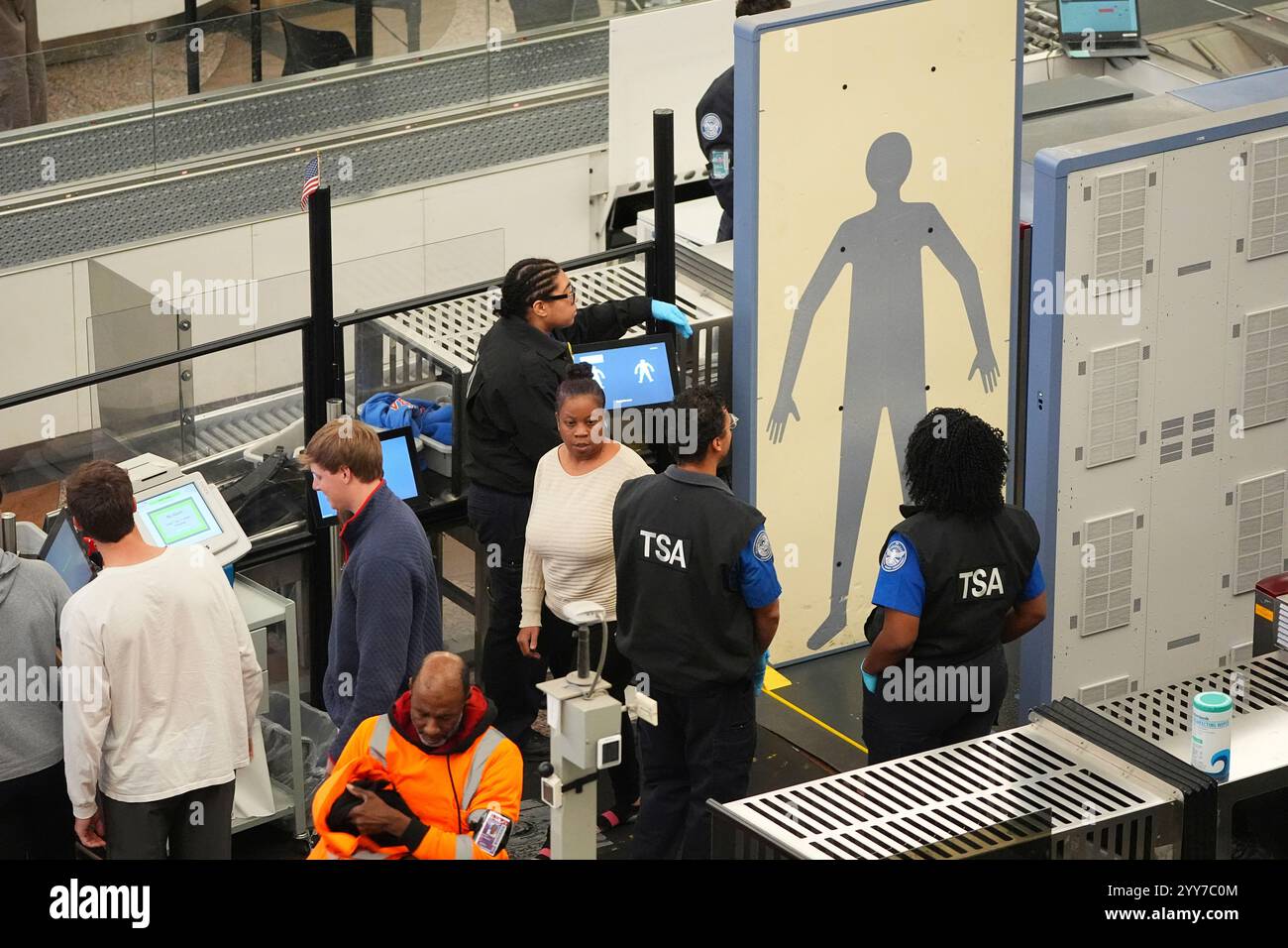 Travelers wade through the south security checkpoint in Denver ...