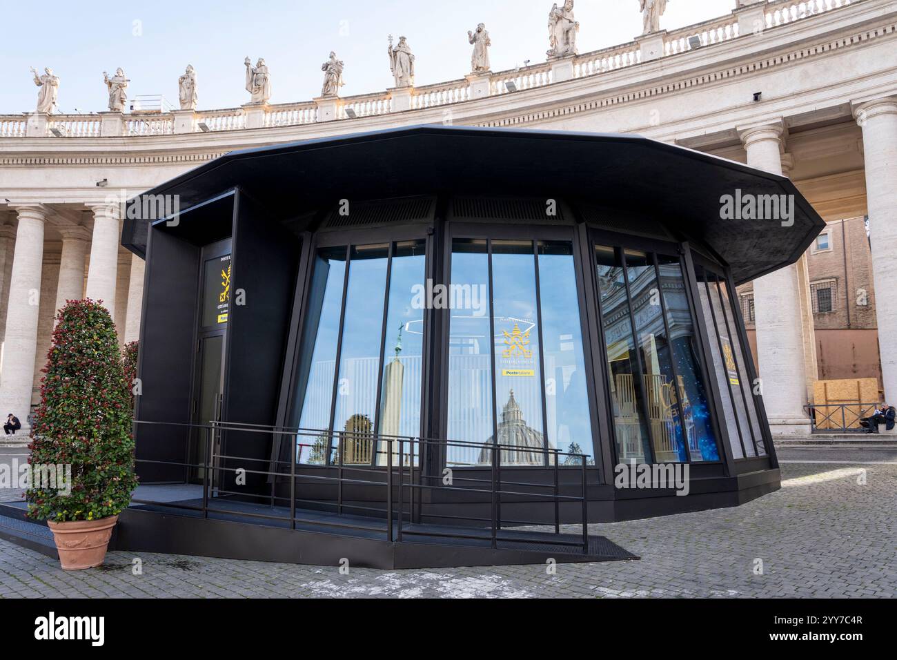 The Dome of St. Peter's Basilica is reflected in the windows of the new ...