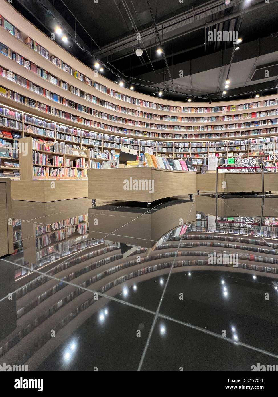 Interior of Tsutaya Bookstore, unique design aesthetic, high shelves ...