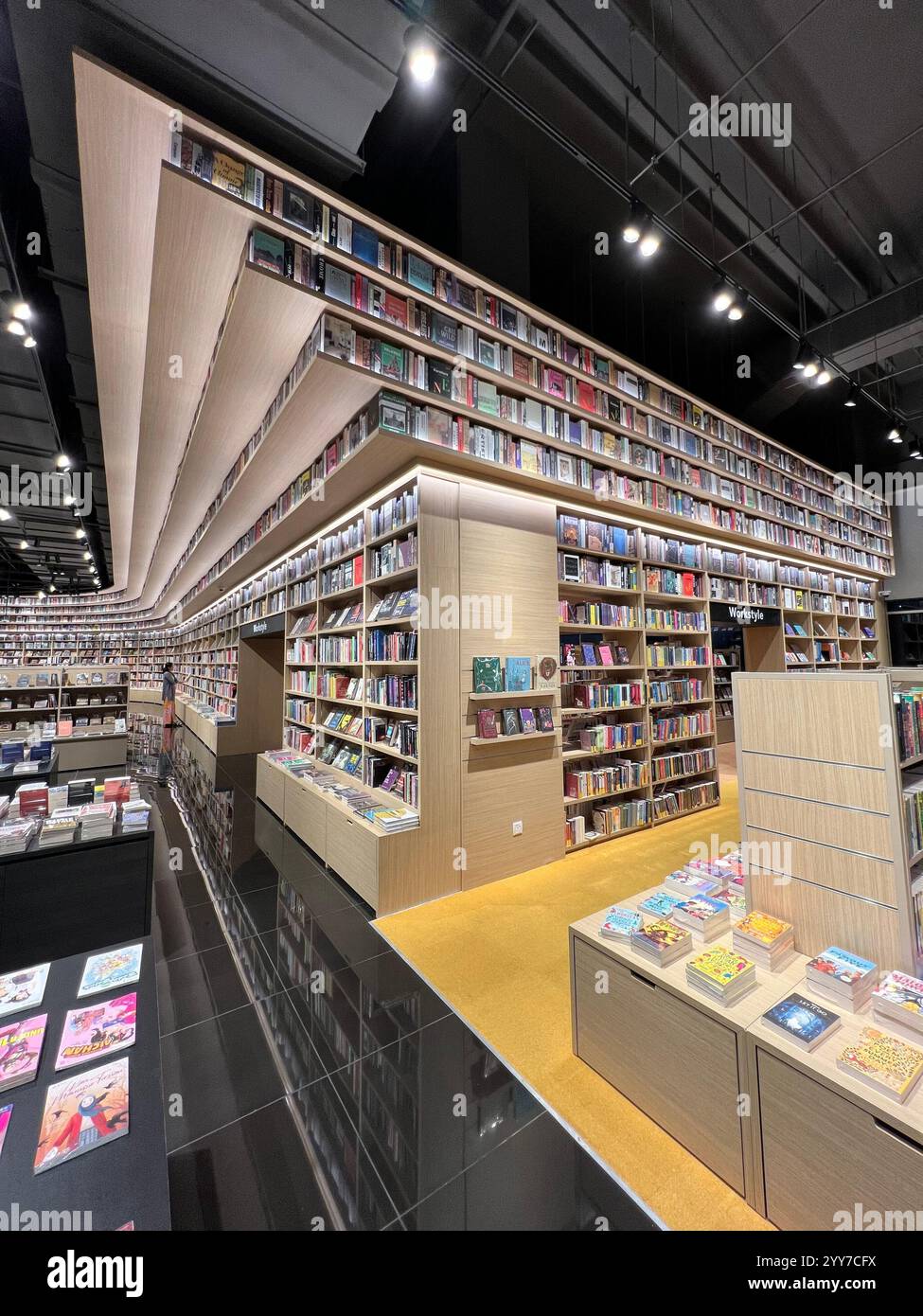 Interior of Tsutaya Bookstore, unique design aesthetic, high shelves ...