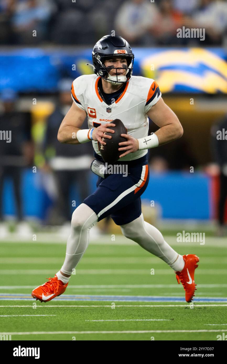 Denver Broncos quarterback Bo Nix (10) runs with the ball during an NFL ...