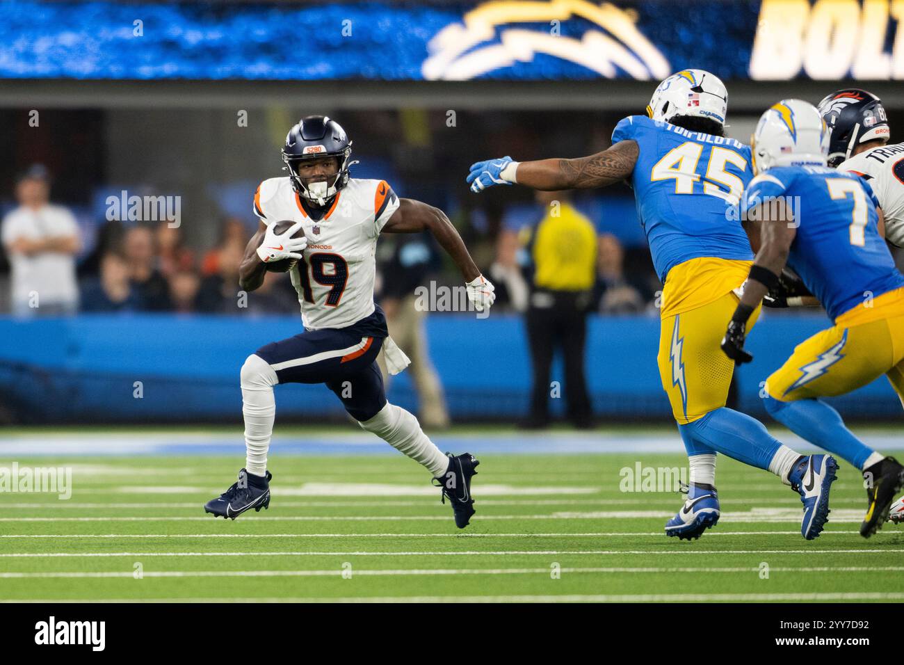 Denver Broncos wide receiver Marvin Mims Jr. (19) runs with the ball during an NFL football game ...