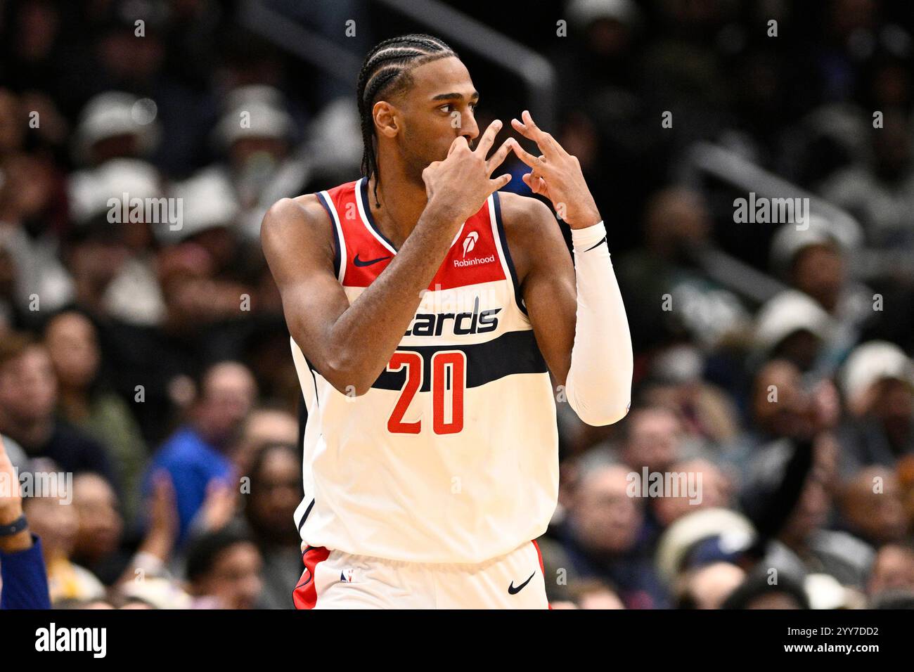 Washington Wizards forward Alex Sarr reacts after he made a three-point ...