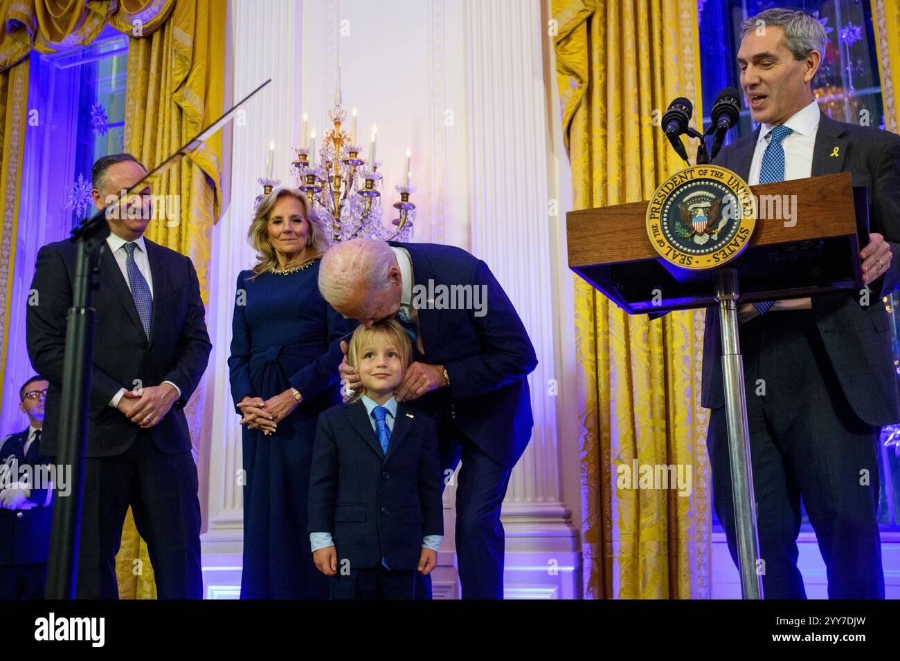President Joe Biden plants a kiss on the head of his grandson Beau ...