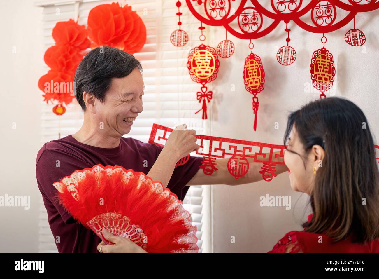 Celebrating chinese new year with elderly traditions in a vibrant home ...