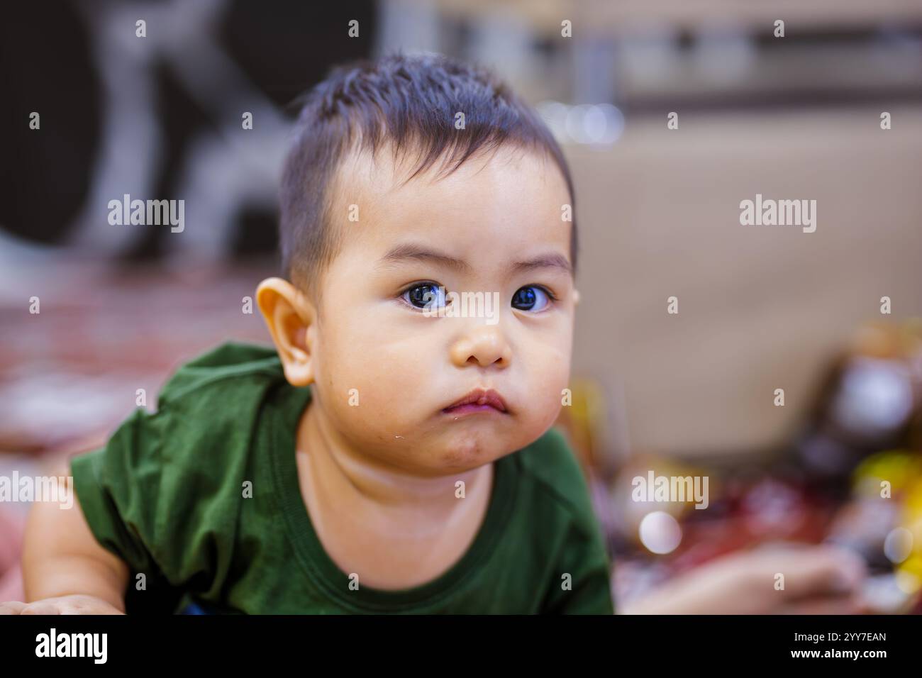 Smiling Baby Boy Posing for a Photo. Happy Asian Baby Boy Sitting Playfully Stock Photo - Alamy