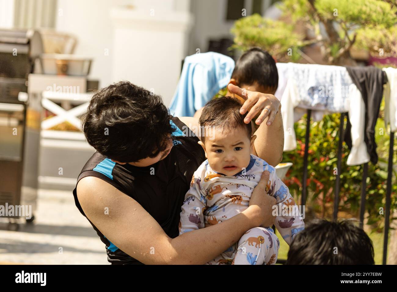 Loving Father Cradling His Baby Boy. Heartwarming Scene of Father and ...