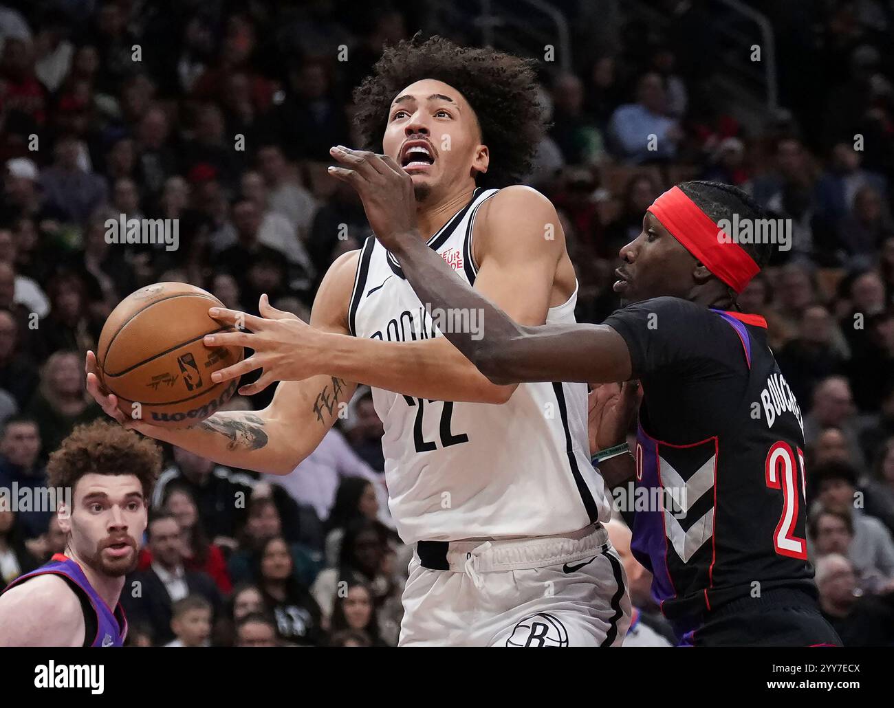 Brooklyn Nets forward Jalen Wilson (22) drives past Toronto Raptors ...