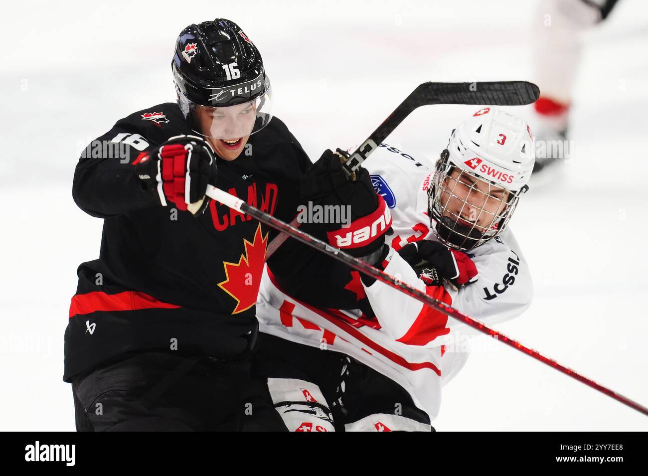 Ottawa, Canada. 19th Dec, 2024. Canada's Carson Rehkopf (16) battles ...
