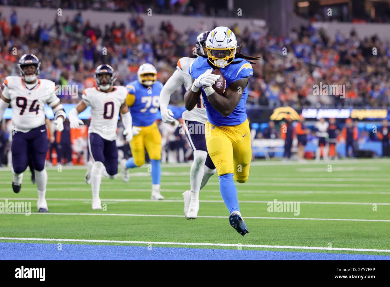 Los Angeles Chargers running back Gus Edwards (4) scores a rushing ...