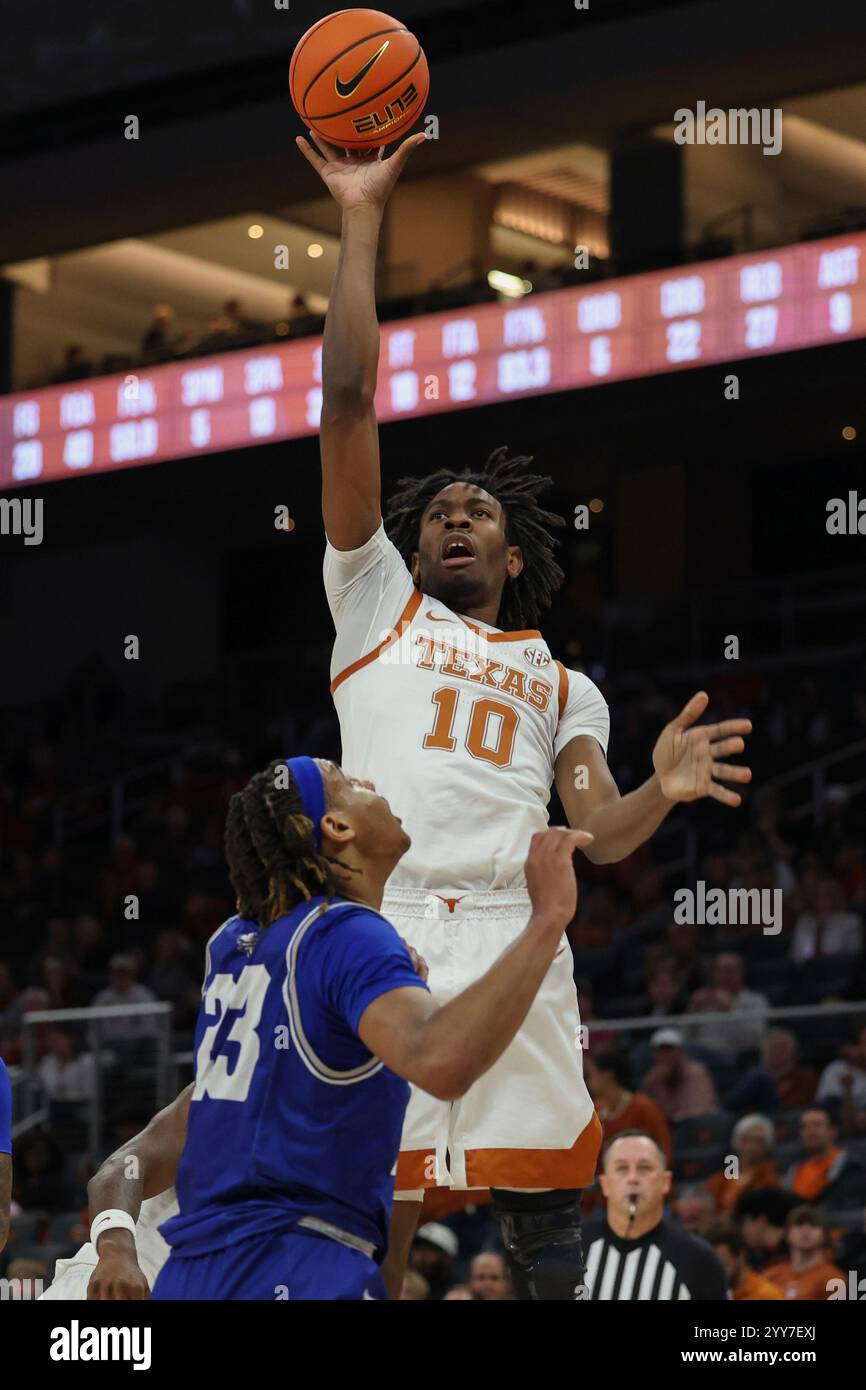 AUSTIN, TX - DECEMBER 19: Texas Longhorns forward Nic Codie (10) takes a shot over New Orleans ...