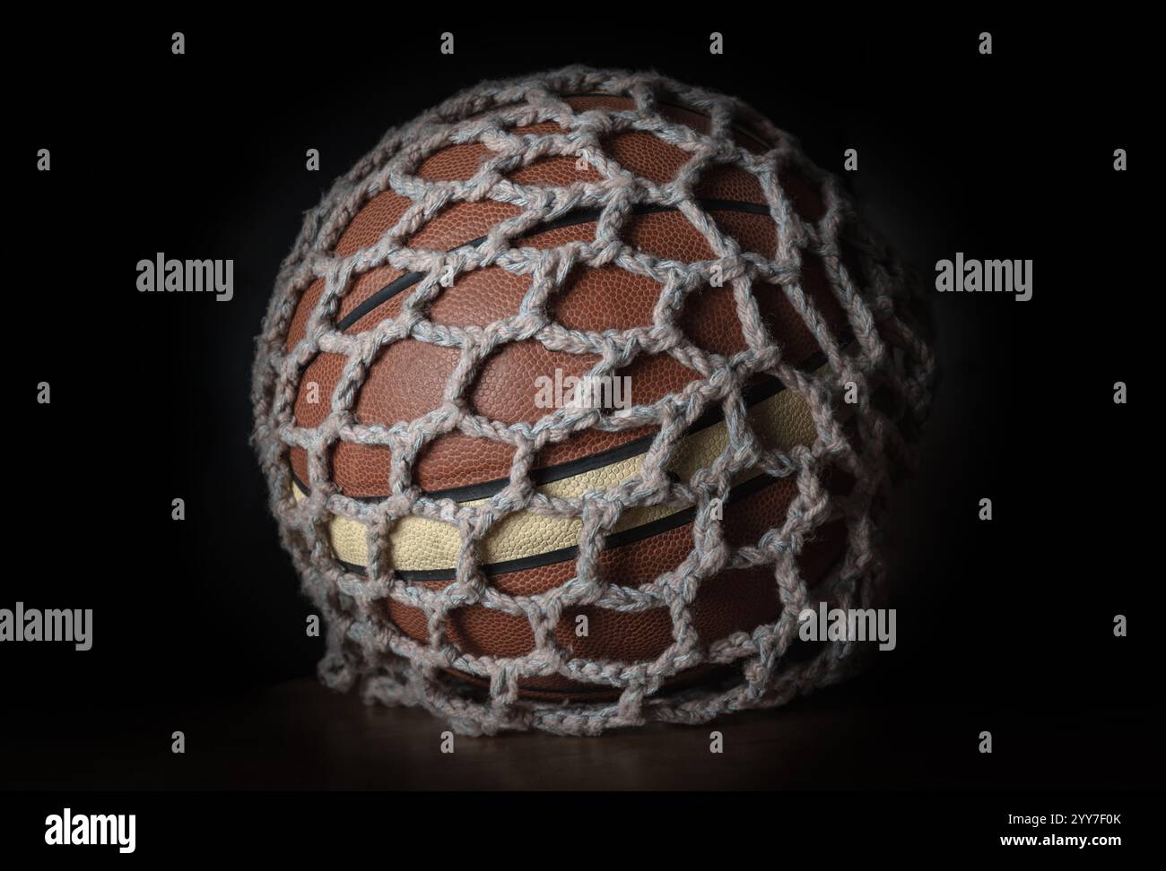 View of Basketball ball inside of Knitting yarn mesh net string bag on ...