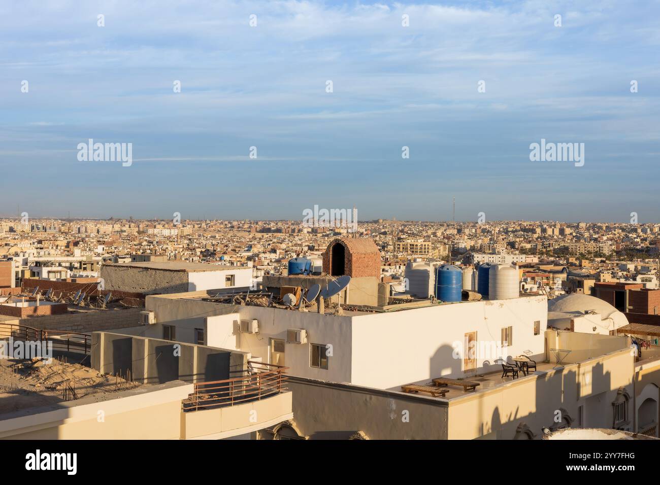 An expansive cityscape from a rooftop perspective, showcasing a blend ...