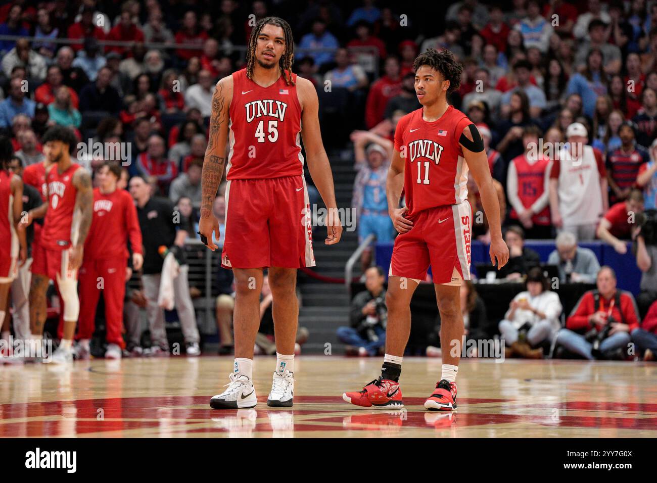 UNLV's Jeremiah Cherry (45) speaks with teammate Dedan Thomas Jr. (11 ...