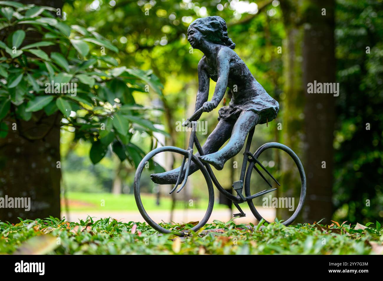 The Girl on a bicycle statue at the Singapore Botanic Garden Stock ...