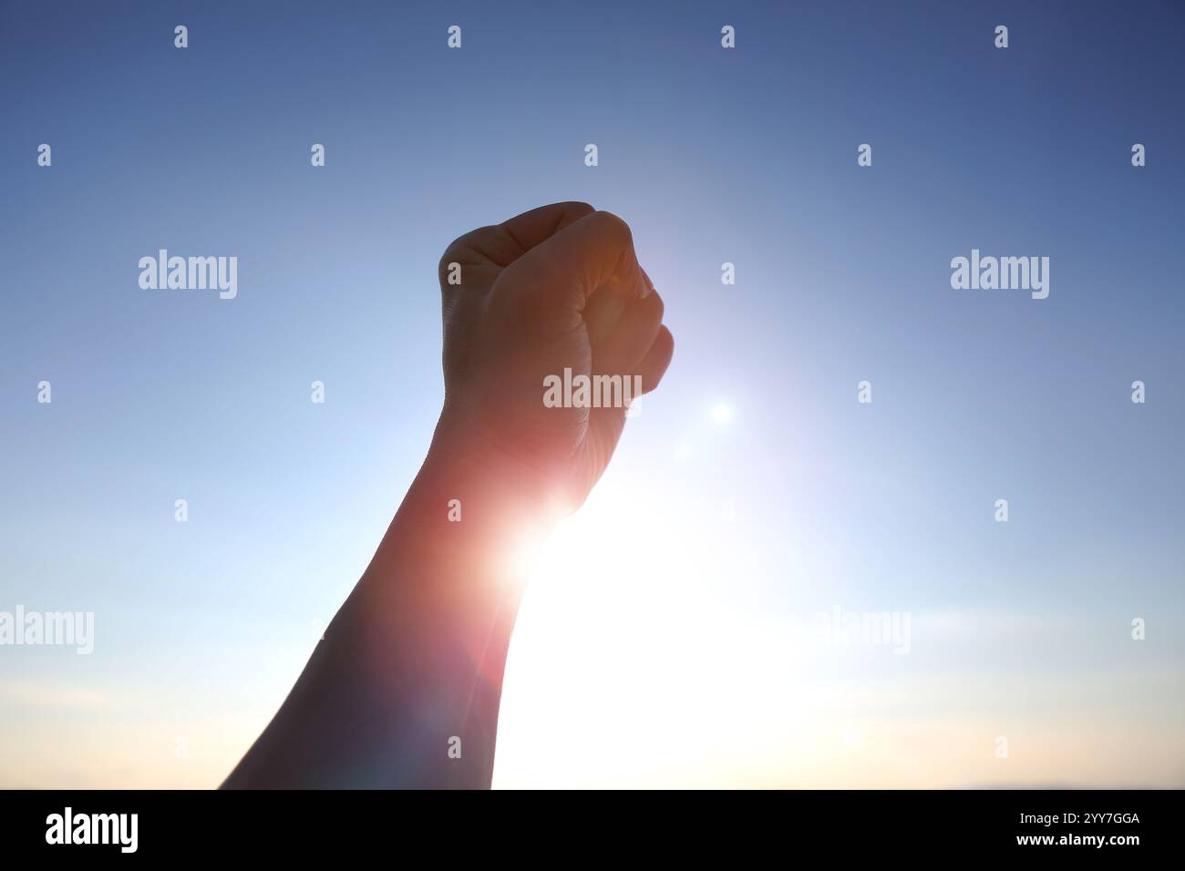 Rising sunrise sun background, brilliant sunlight shining through arms ...