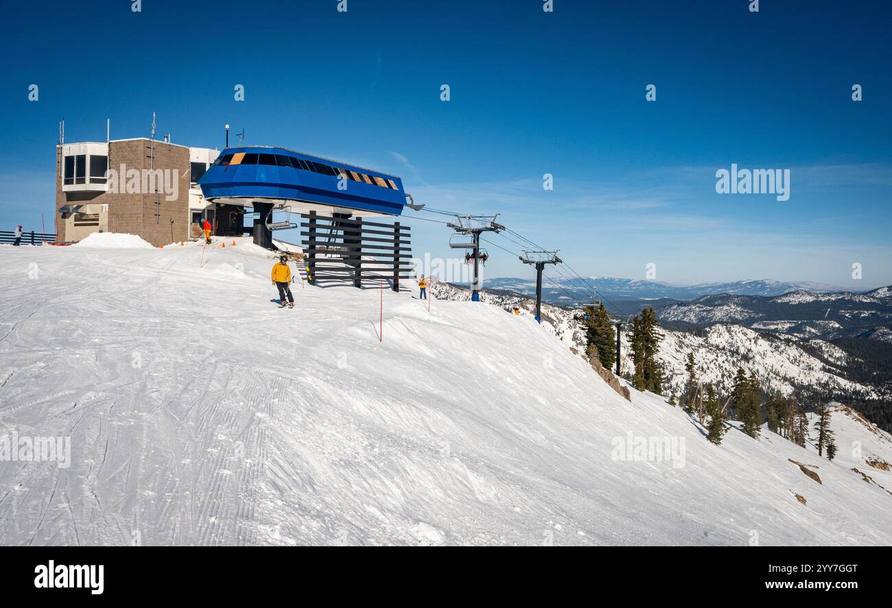 A skiier prepares to ski down form the Summit Express Chairlift (elev ...