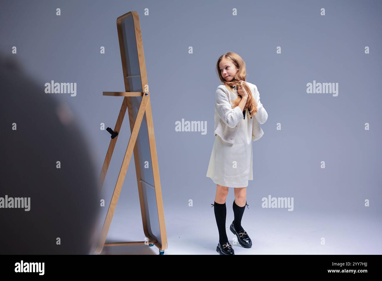A captivating portrait of a young girl in a studio, showcasing her ...
