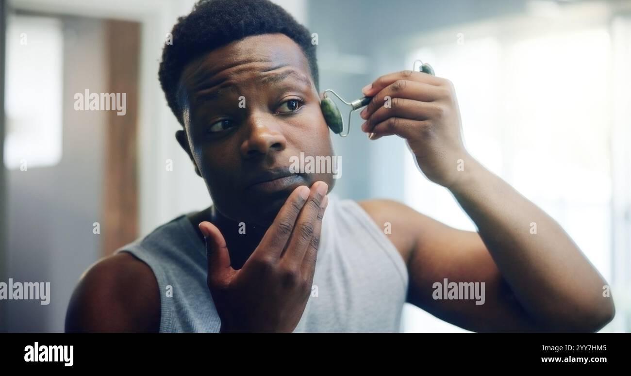 Black man, jade roller and face with skincare for dermatology, facial ...