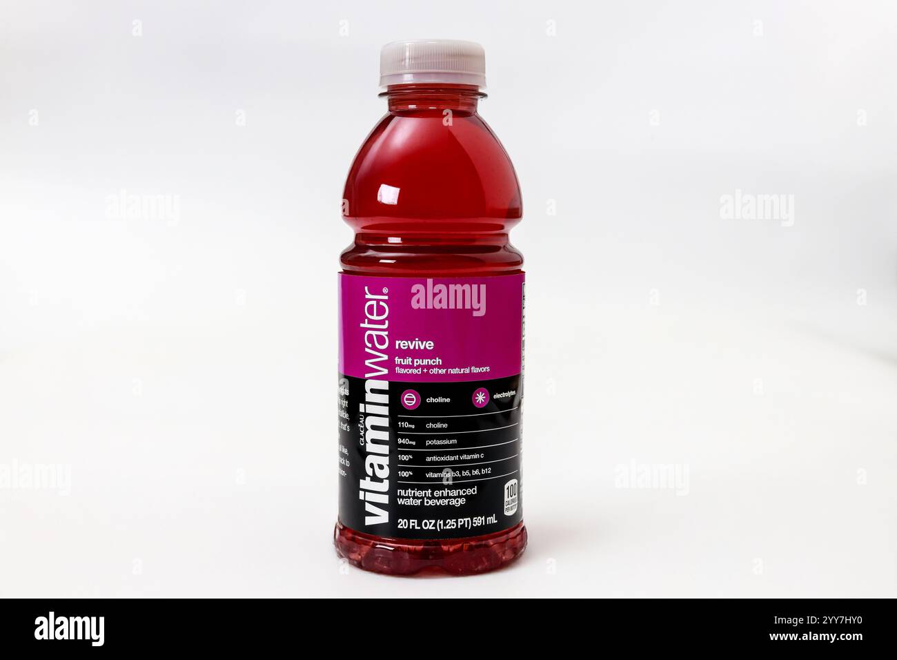 Refreshing pink vitamin water bottle featuring fruit punch flavor with ...