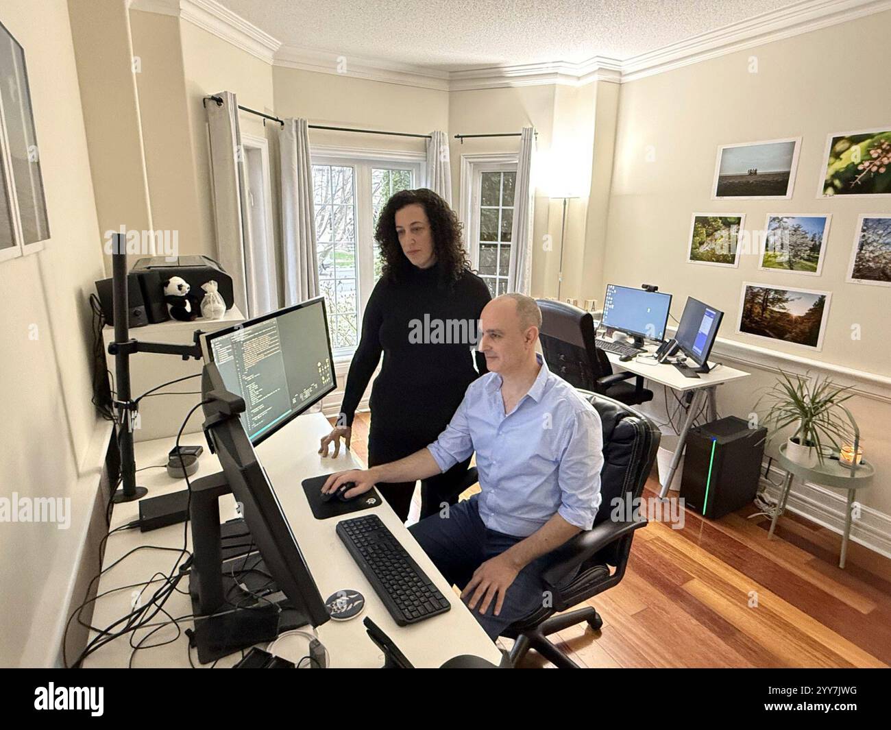 Michal Harel and her husband Avital Epstein show the website they set ...