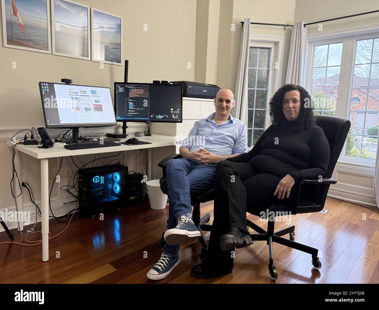 Michal Harel and her husband Avital Epstein show the website they set ...