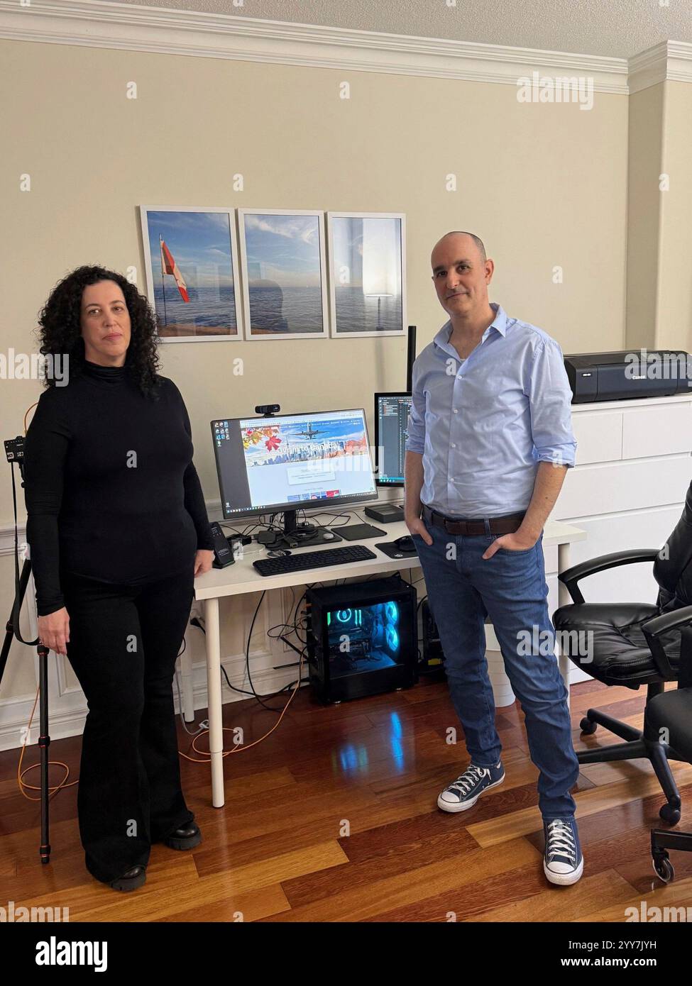 Michal Harel and her husband Avital Epstein show the website they set ...