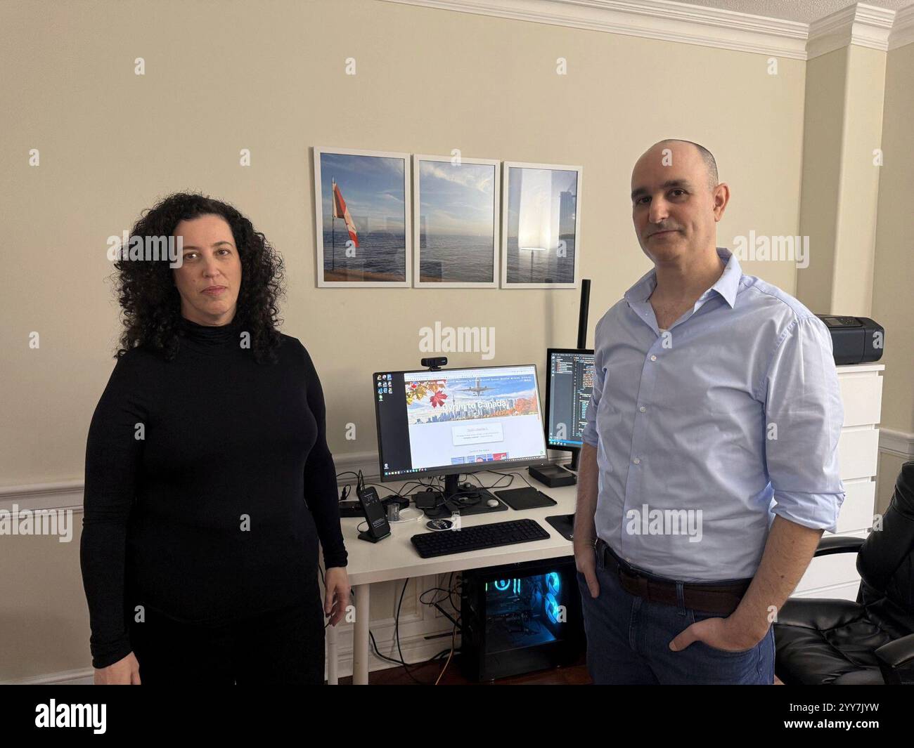 Michal Harel and her husband Avital Epstein show the website they set ...