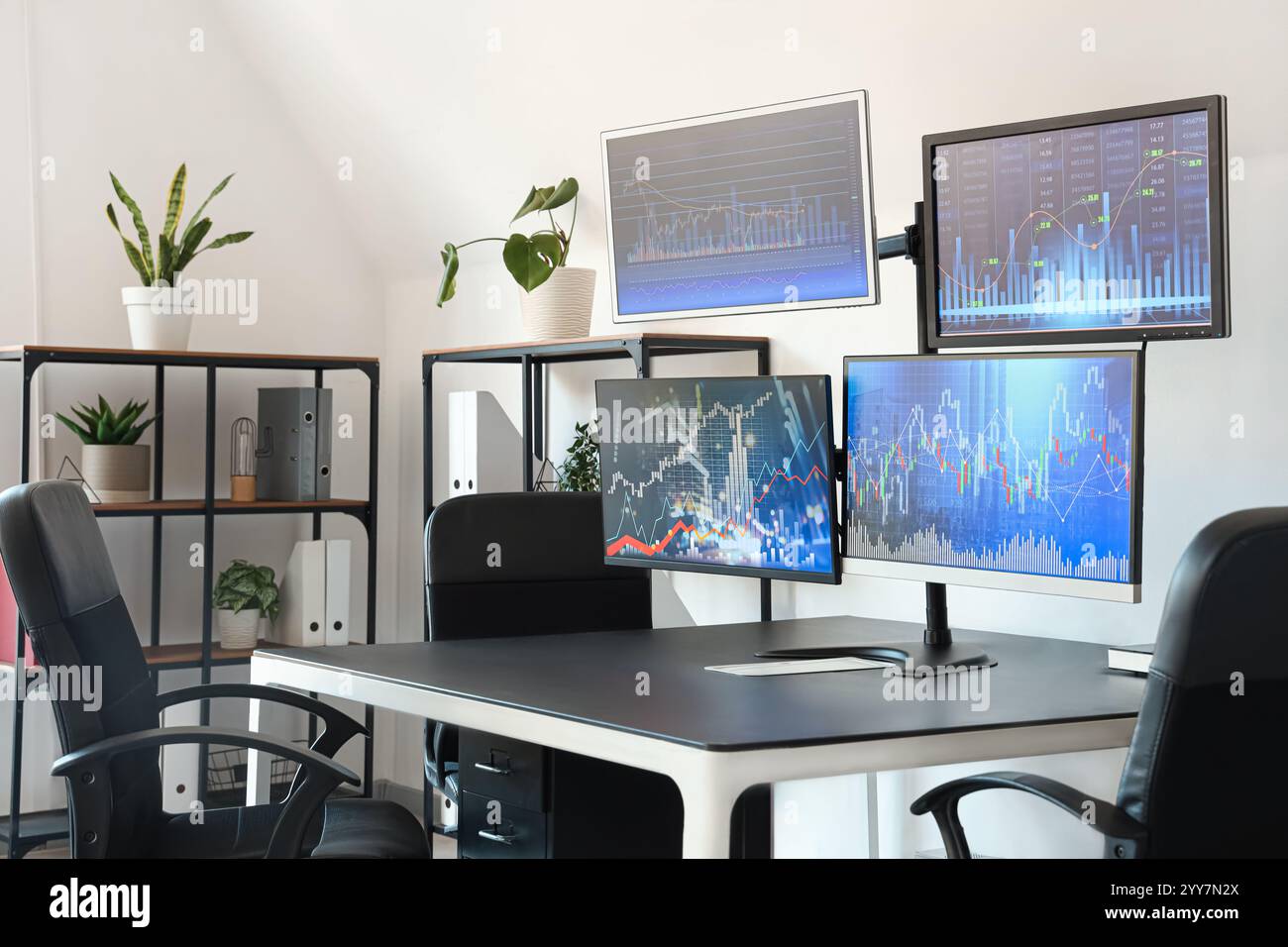 Interior of trader's office with desk and shelf units Stock Photo - Alamy