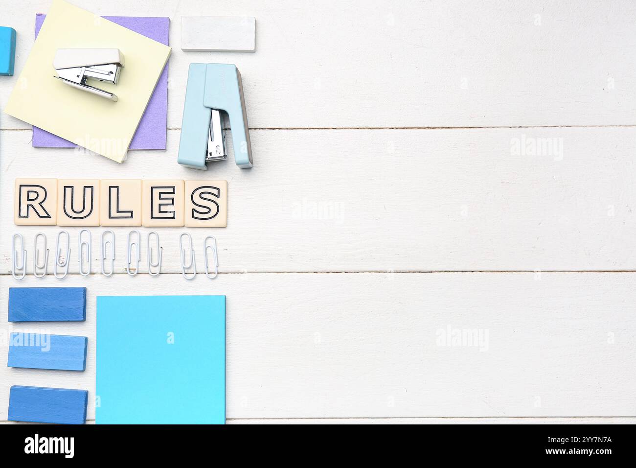 Word RULES with stationery supplies on white wooden background Stock ...