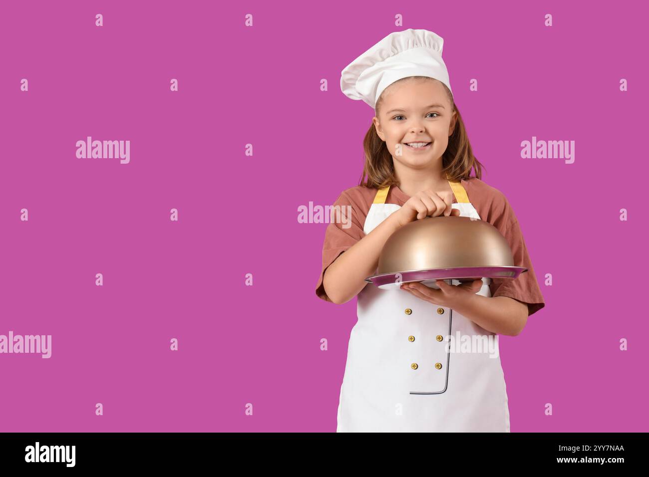 Cute chef with cloche on violet background Stock Photo - Alamy