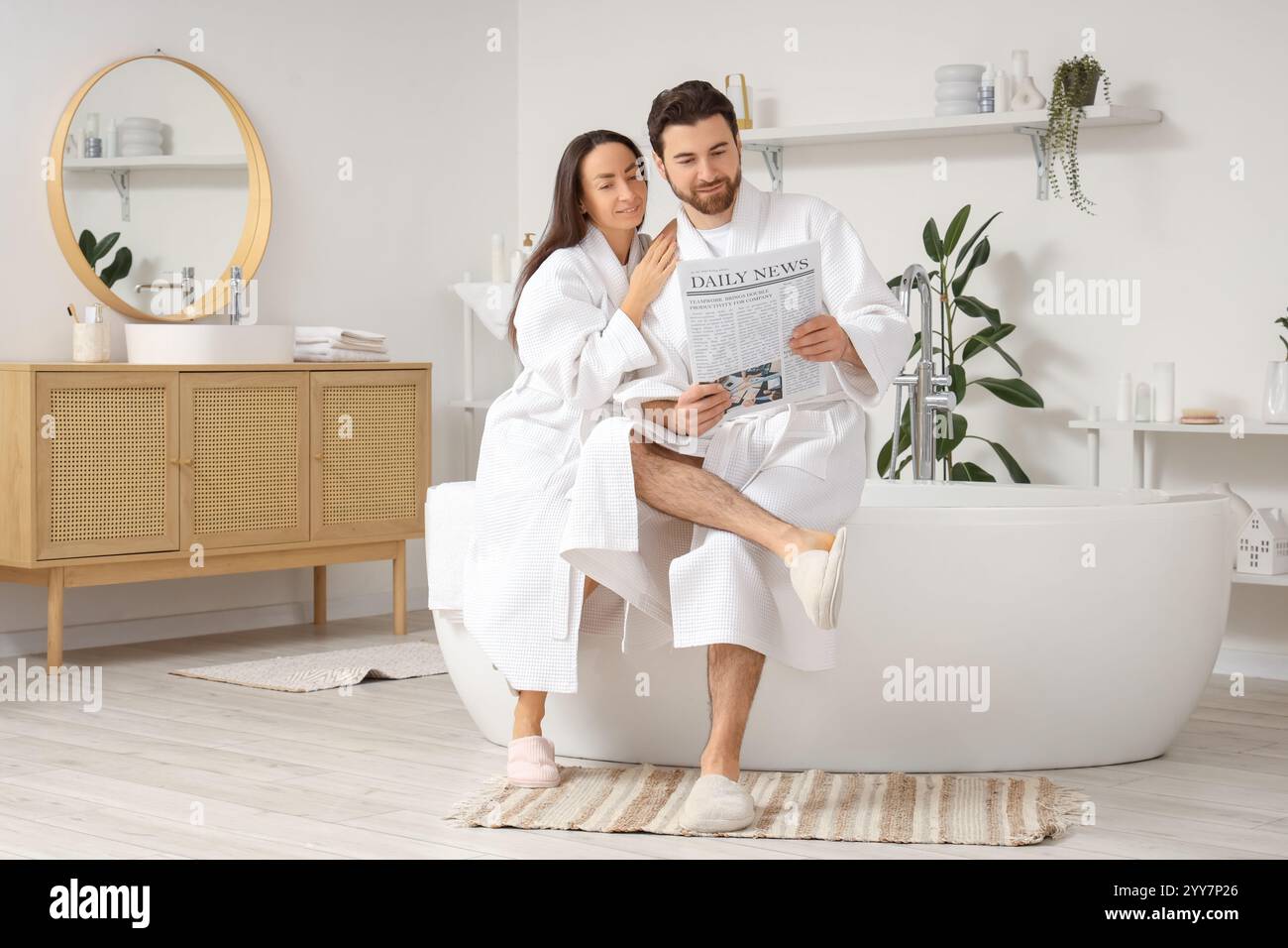 Woman reading newspaper in bathroom hi-res stock photography and images ...