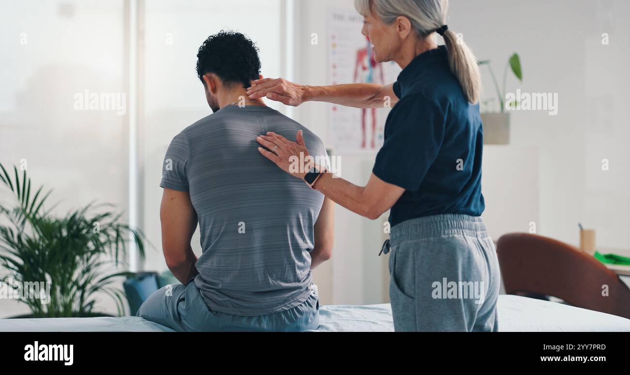 Physiotherapy, back massage and patient man at consultation for spinal ...