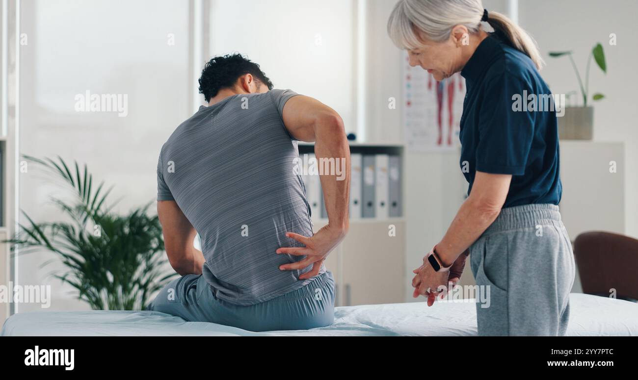 Back pain, physical therapy and patient at consultation for problem ...
