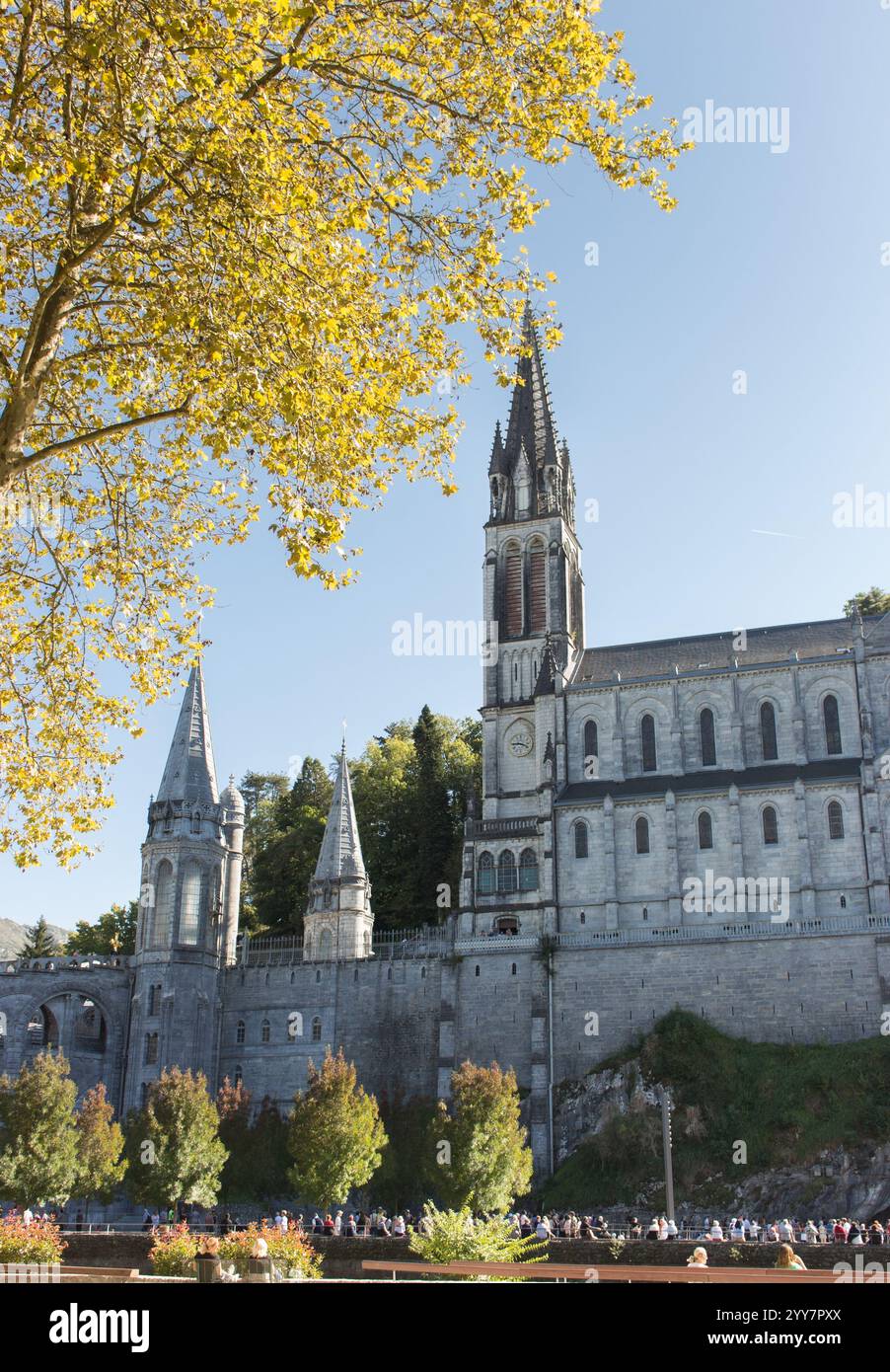 Sanctuary of Our Lady of Lourdes on sunny day. Spiritual centre of pilgrims. Lourdes landmark ...