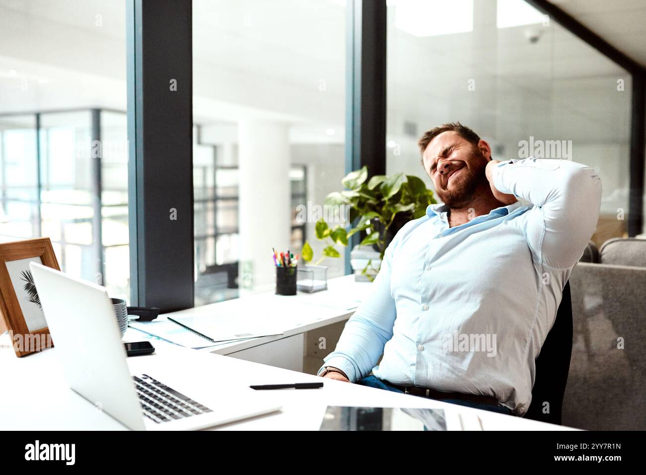 Office, businessman and neck pain with laptop for research, muscle ...