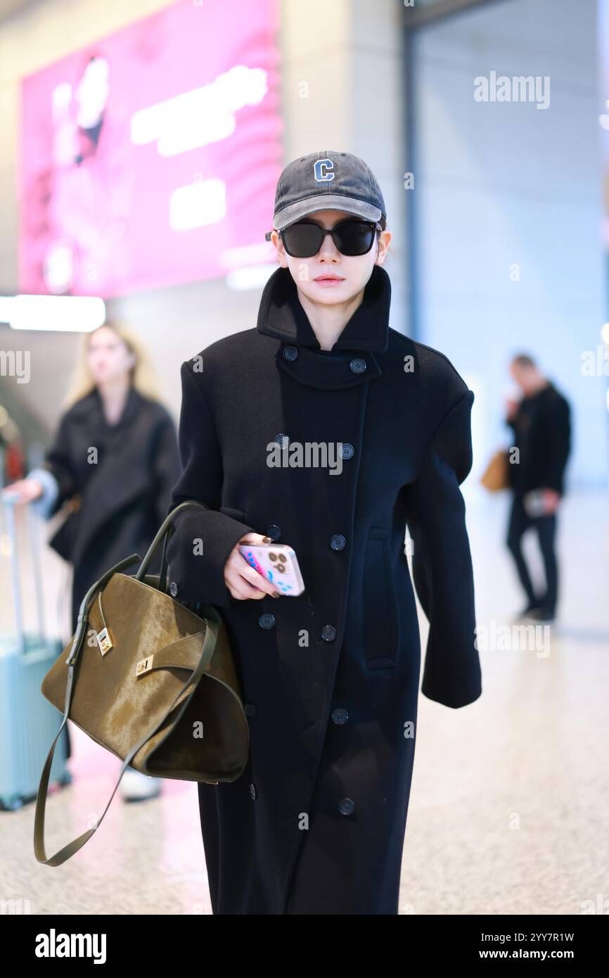 Chinese singer and actress Stephy Qi appears at the airport in Shanghai ...