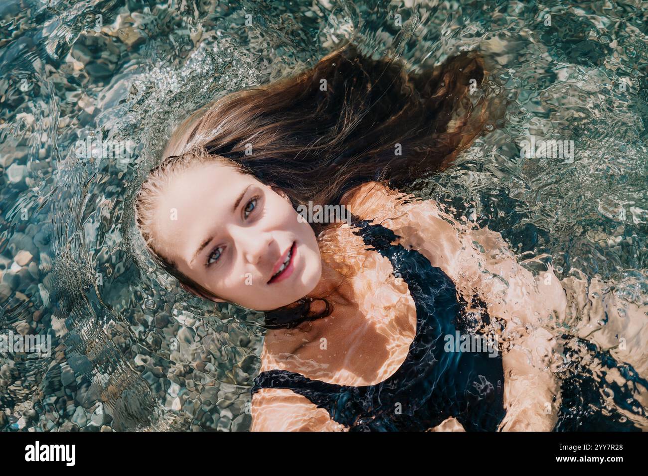 Woman in bikini floating clear hi-res stock photography and images - Alamy