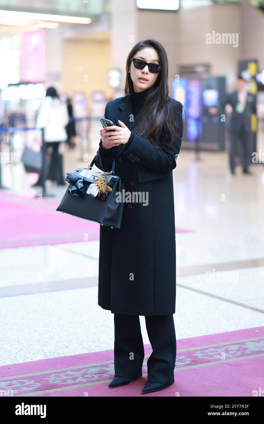 Chinese actress Wang Ziwen appears at the airport in Shanghai, China ...
