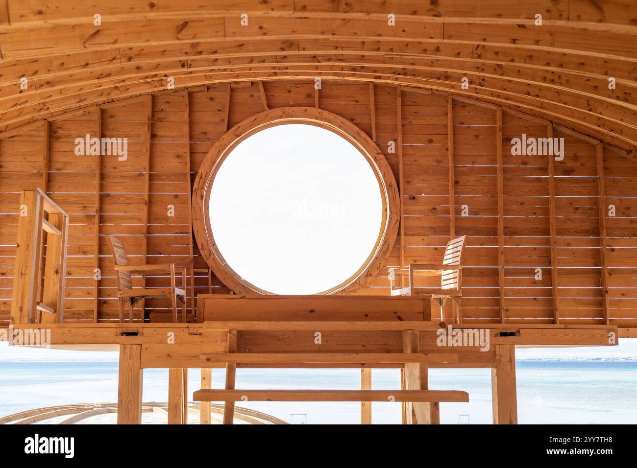 This inviting image showcases a serene wooden interior with a unique ...