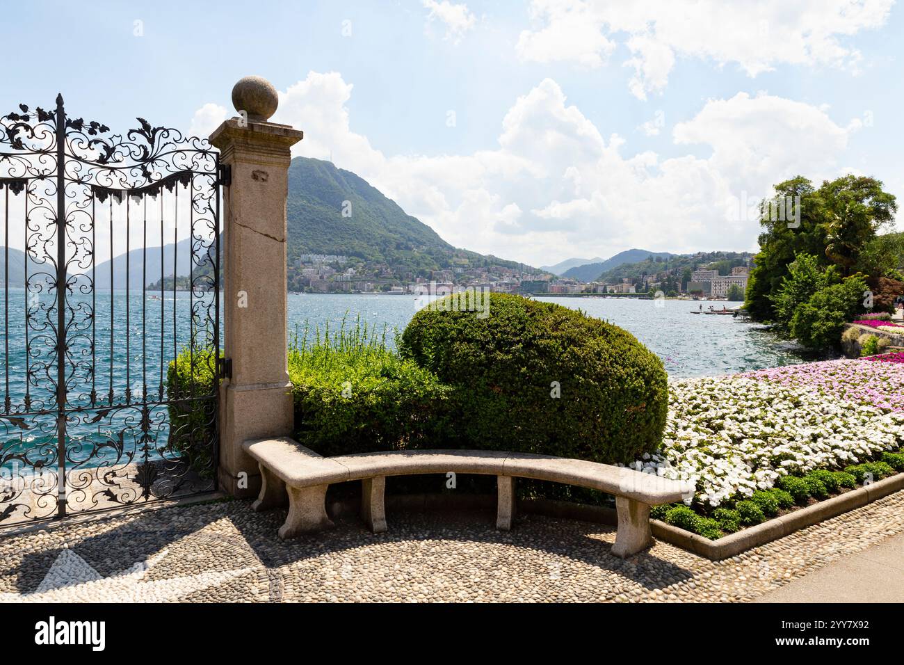 Switzerland, Lugano, 22. June 21. Lake waterfront with wrought iron ...
