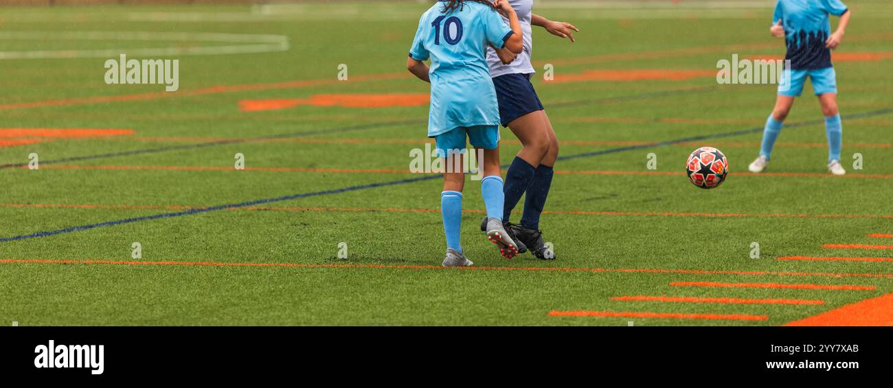 Female Soccer players performs an action play on a professional soccer ...