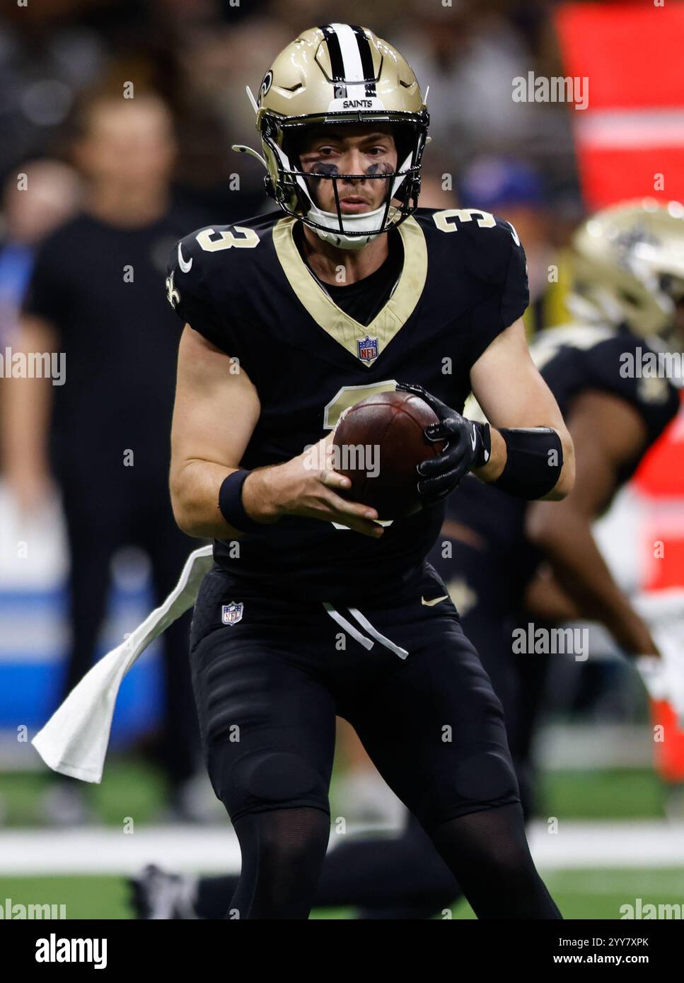 New Orleans Saints quarterback Jake Haener (3) receives the snap at the Washington Commanders vs ...