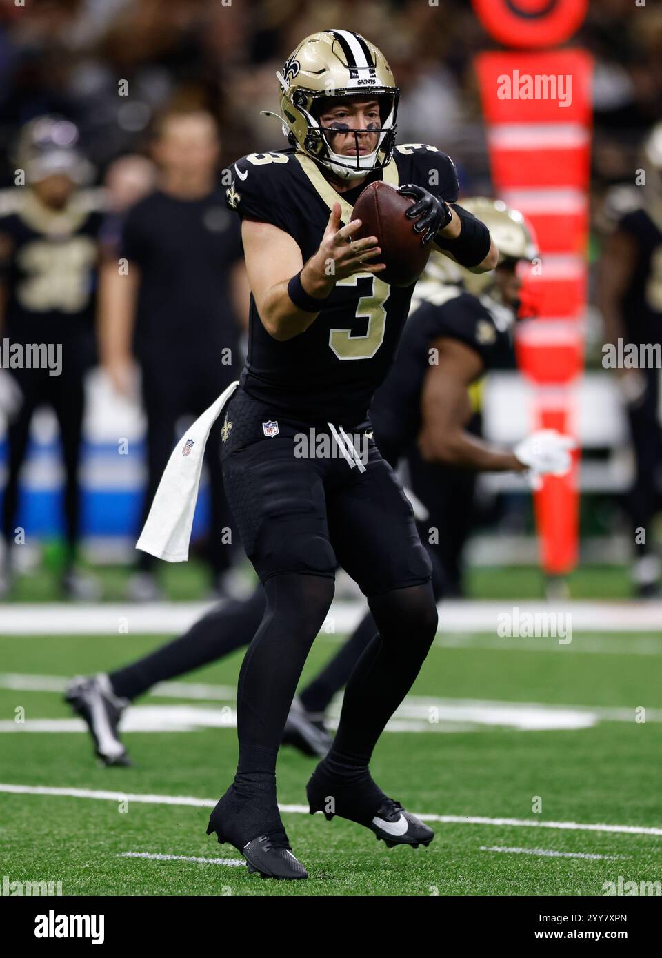 New Orleans Saints quarterback Jake Haener (3) receives the snap at the Washington Commanders vs ...
