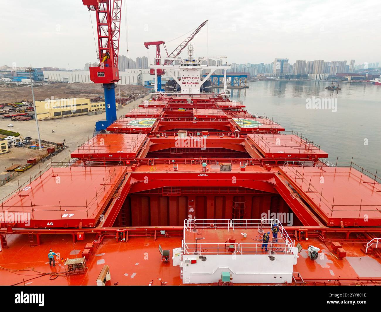 QINGDAO, CHINA - DECEMBER 20, 2024 - Multiple large ships are under ...
