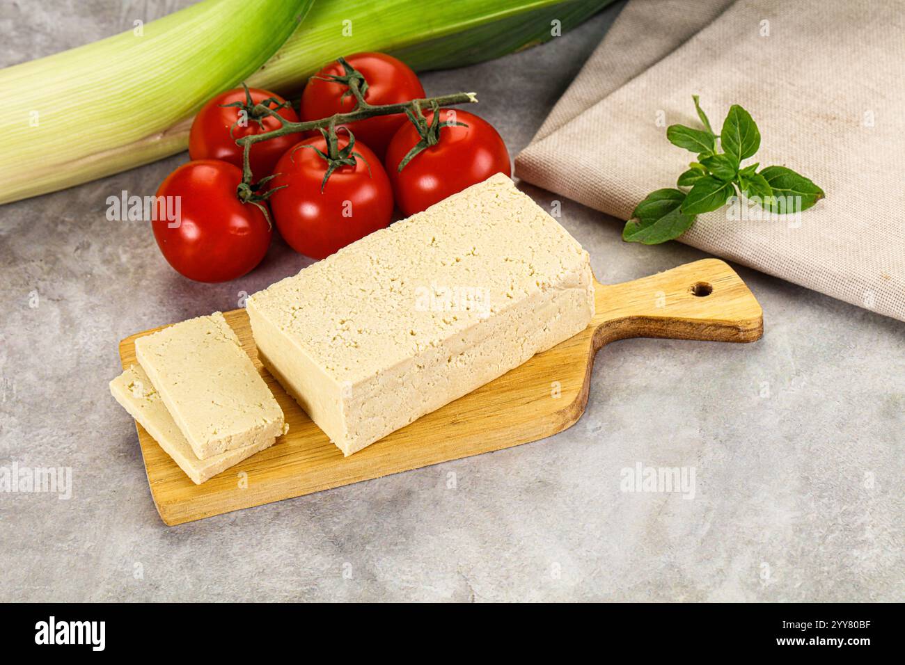 Soya vegan tofu cheese brick over board Stock Photo - Alamy