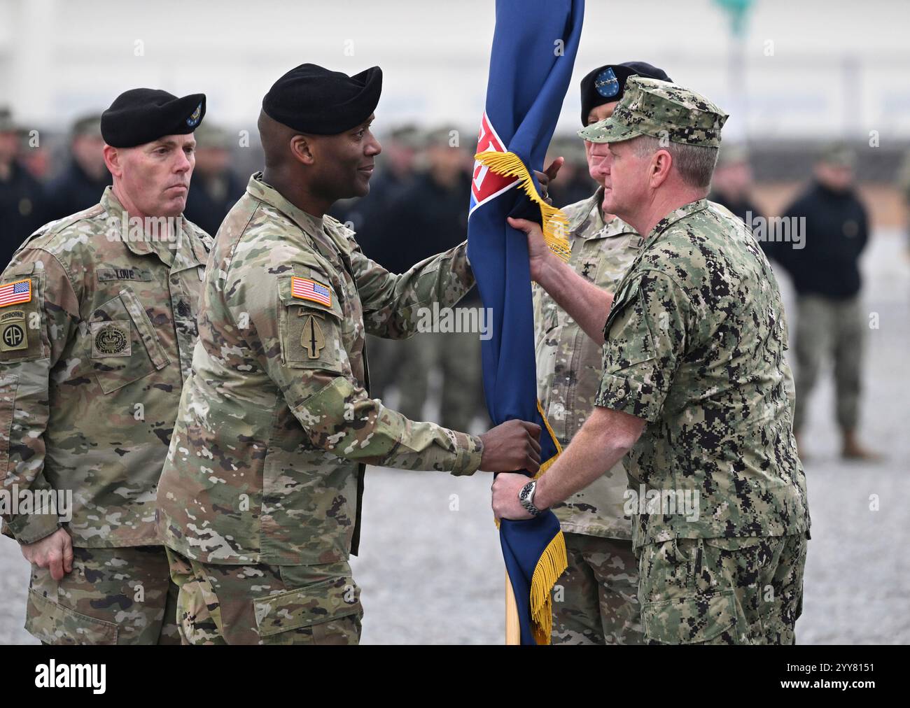 Incoming commander Gen. Xavier Brunson, center left, receives the ...