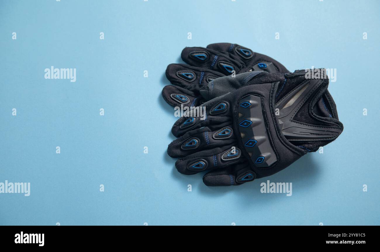 Motorcycle gloves on the blue background Stock Photo - Alamy